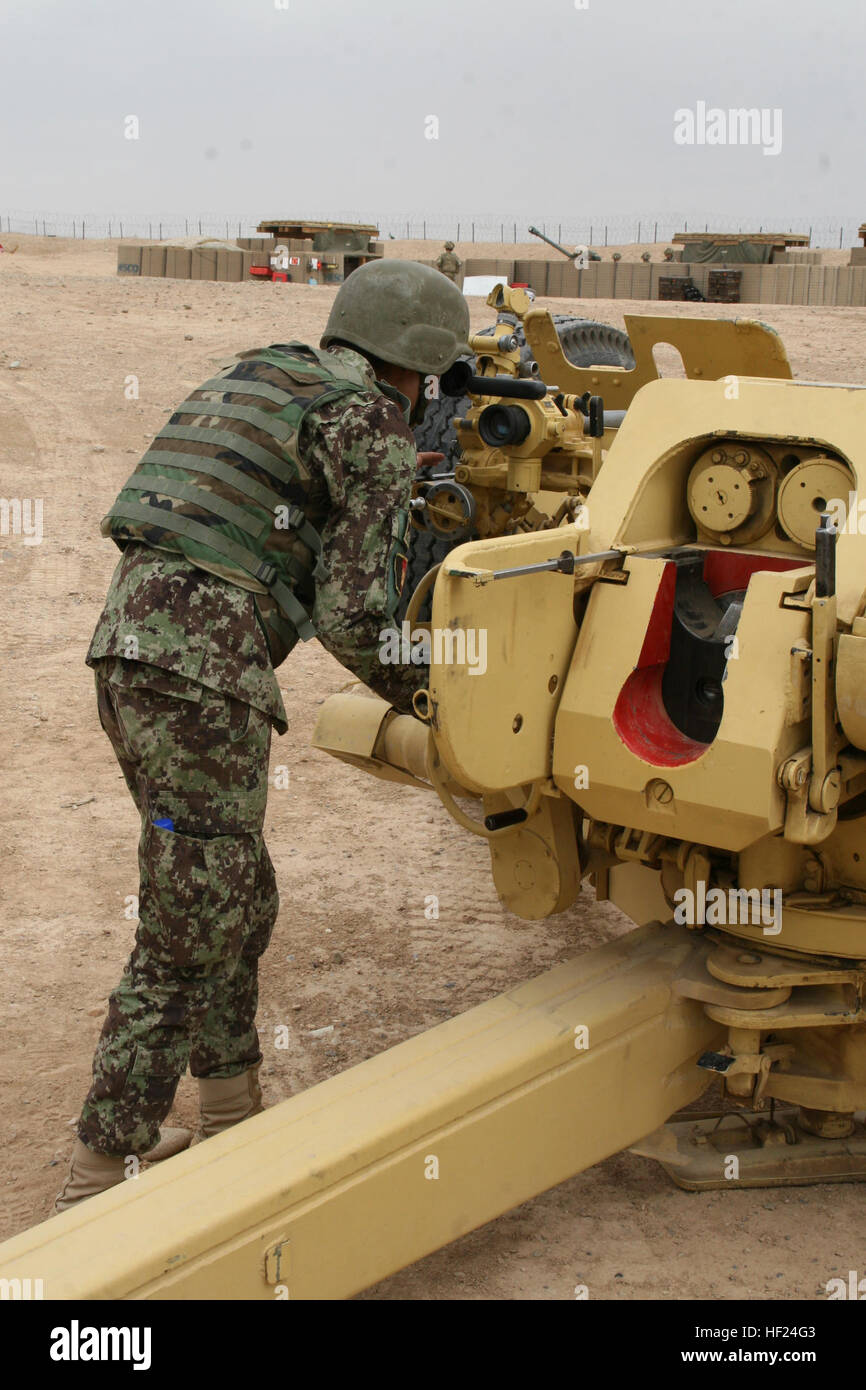 An Afghan National Army soldier with the 215th Corps carefully makes ...