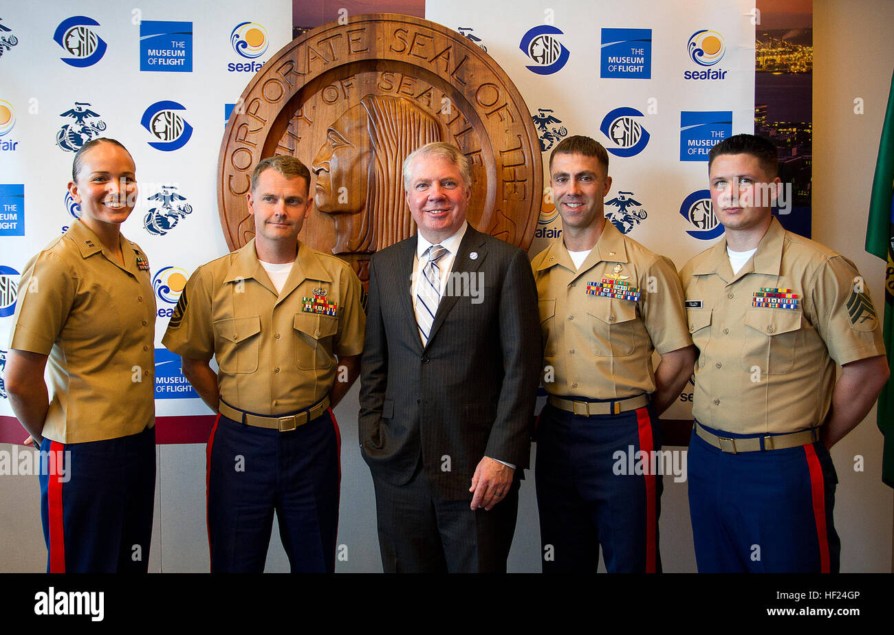 Seattle Mayor Ed Murray (center) poses with Capt. Alissa Tarsiuk (left ...