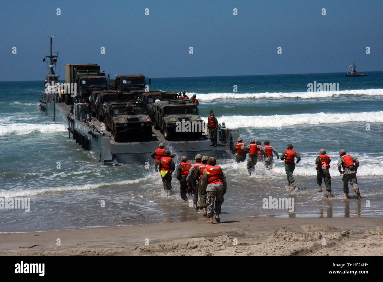 Army Soldiers offloaded a floating causeway at Red Beach, Camp ...