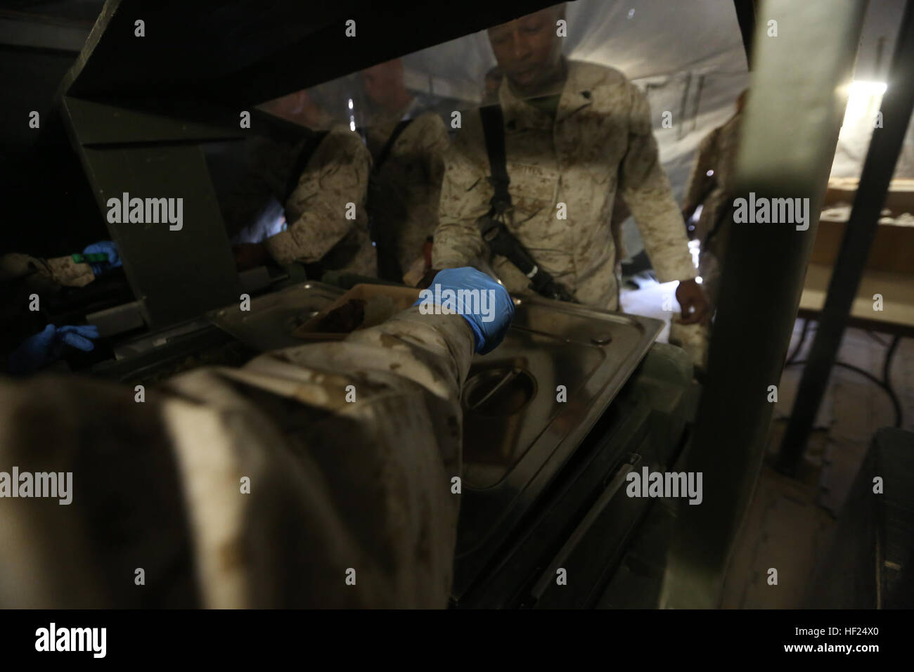 U.S. Marines with Headquarters Regiment, 1st Marine Logistics Group, go ...