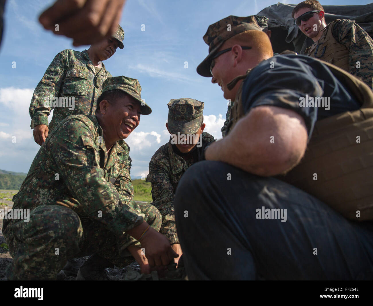 U.S. Marine Lance Cpl. Ted M. Gustafson takes a moment with Philippine ...