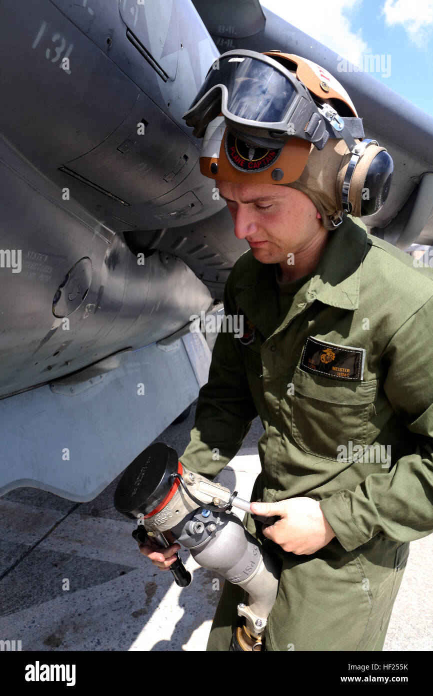 U.S. Marine Corps Lance Cpl. Devin T. Meister, left, a plane captain ...