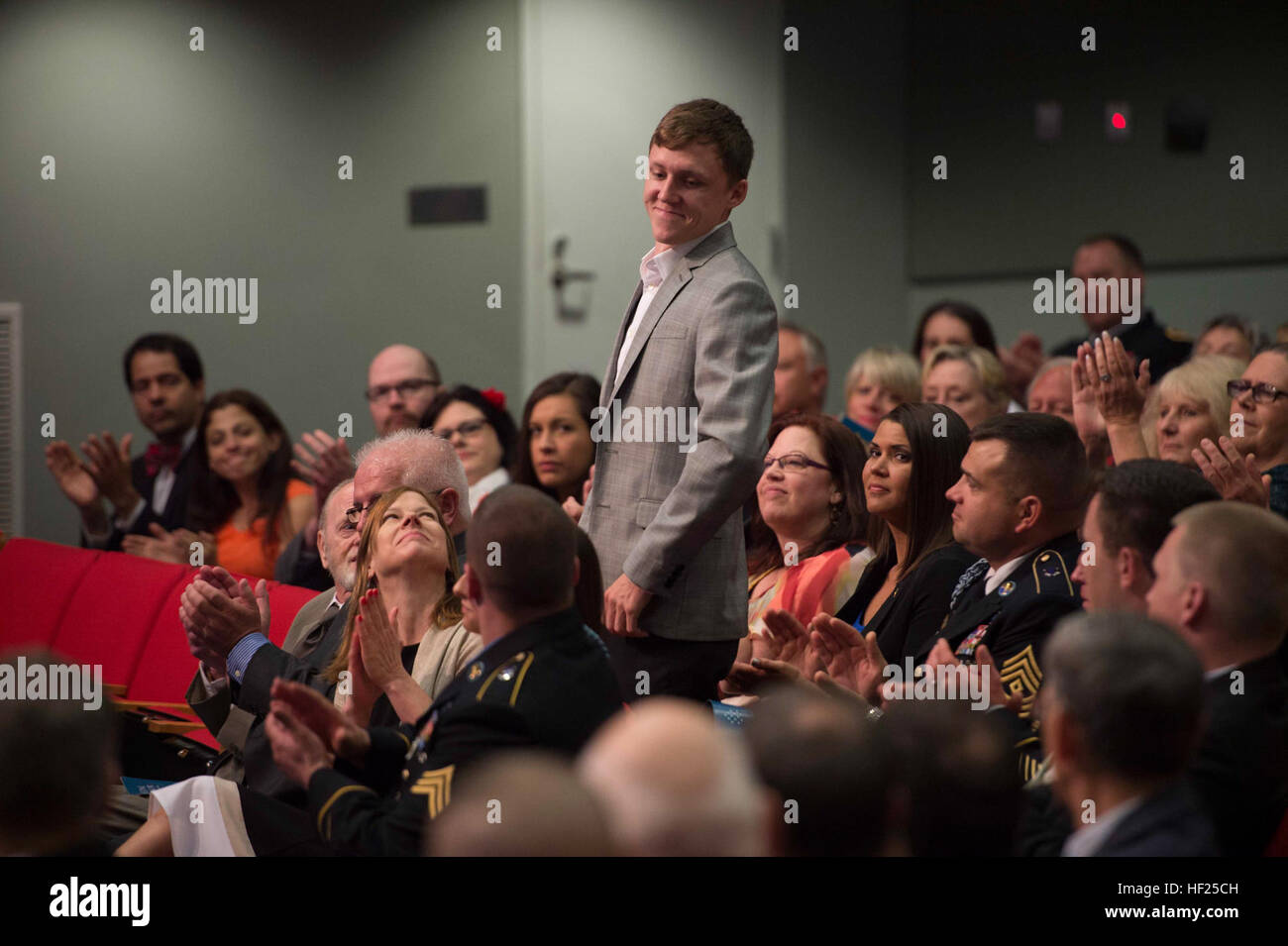 Mr. Kain Schilling, stands to be recognized during a ceremony to induct ...
