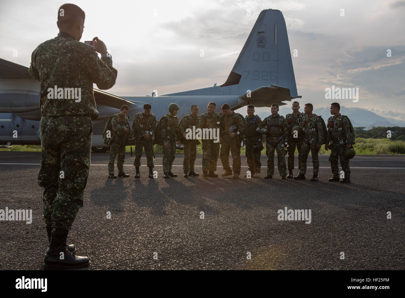 Philippine Marines and U.S. Marines take a group photo in front of a KC ...