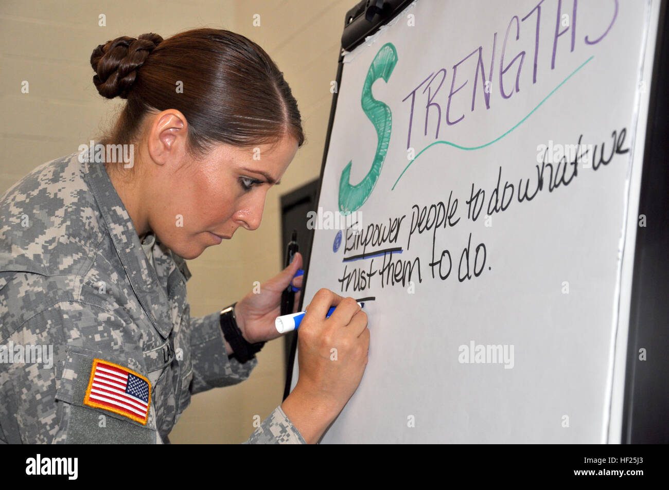 Army Spc. Ciara Laboy takes notes during a group discussion about ...
