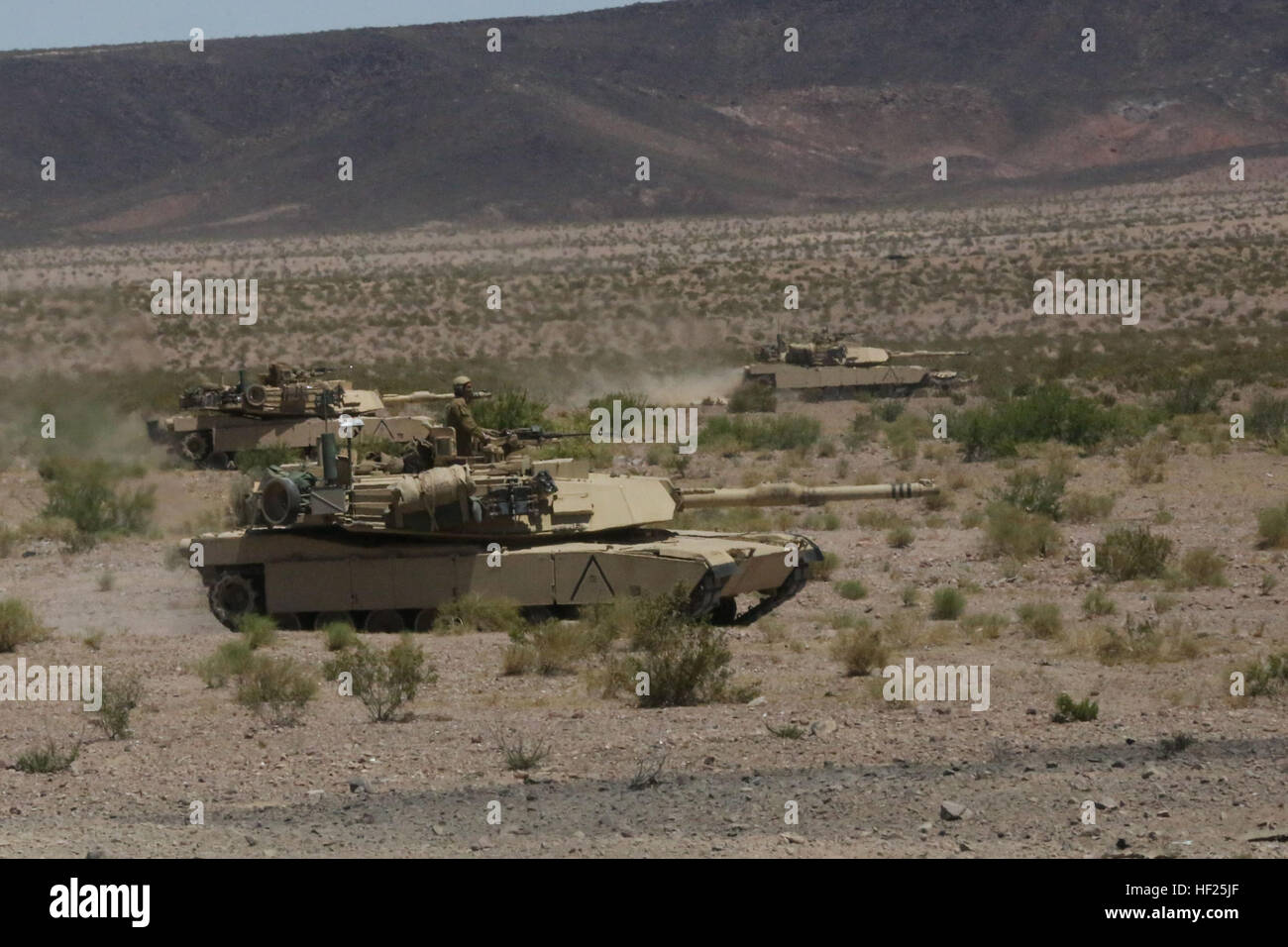 Marines with Alpha Company, 1st Tank Battalion, advance in formation on ...