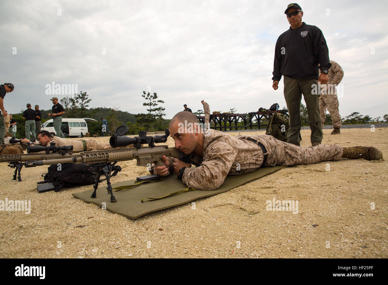 Sgt. Vincent J. Petitto sights in with an M110 semi-automatic sniper ...