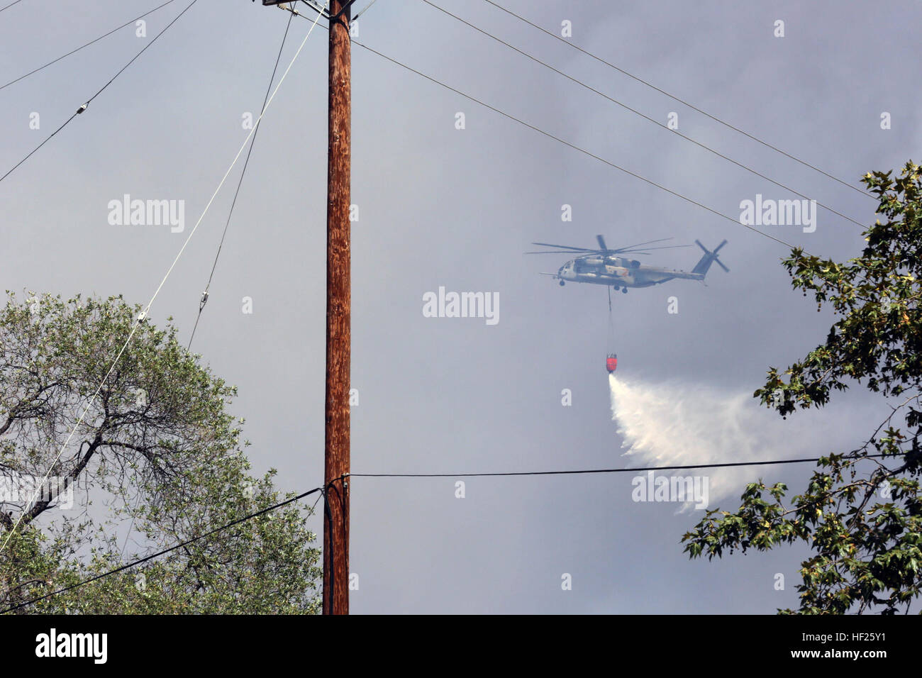 A U.S. Marine Corps CH-53E Super Stallion helicopter prepares to drop ...