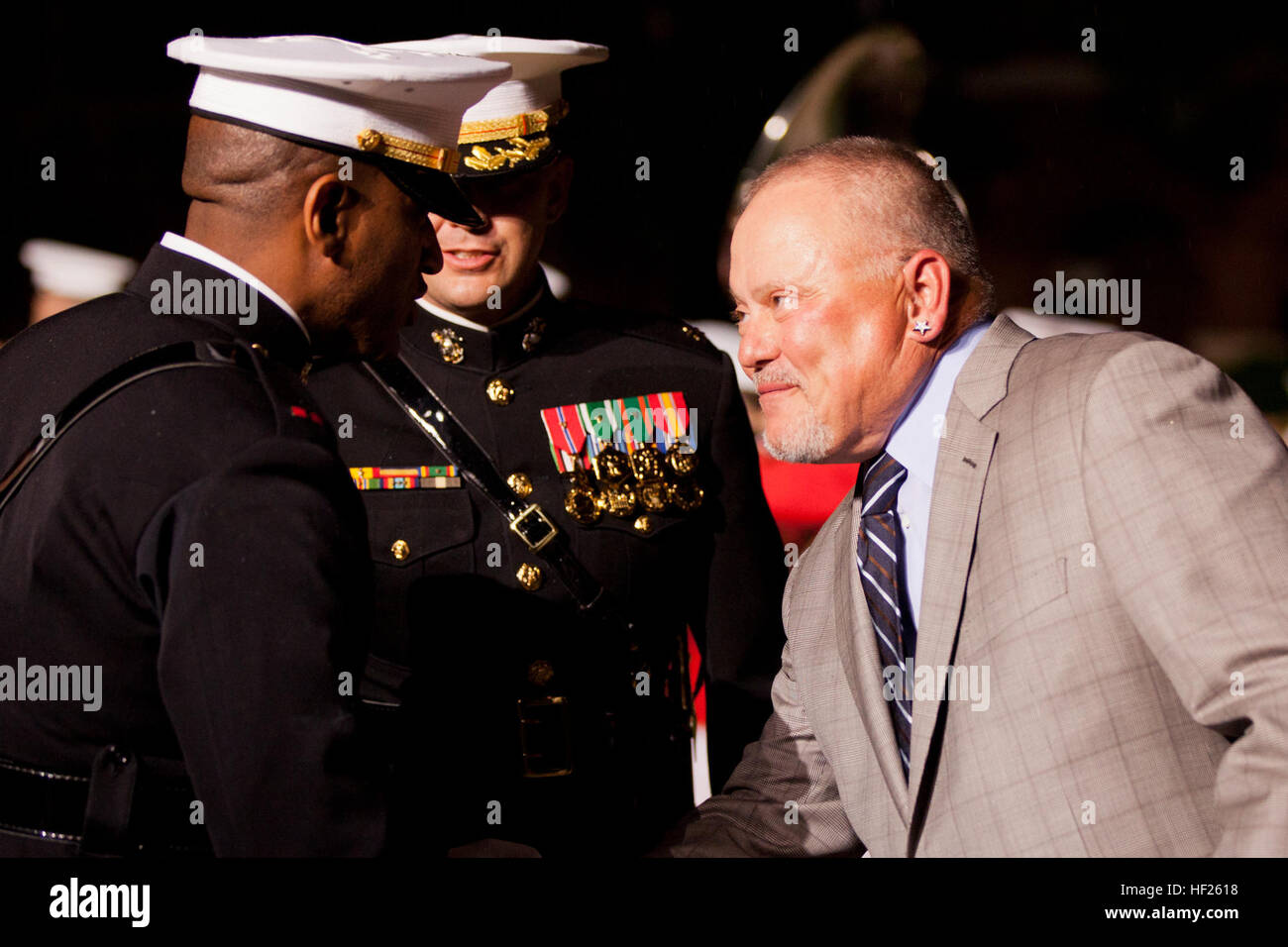 The Evening Parade guest of honor, Bob Parsons, right, greets Marines ...