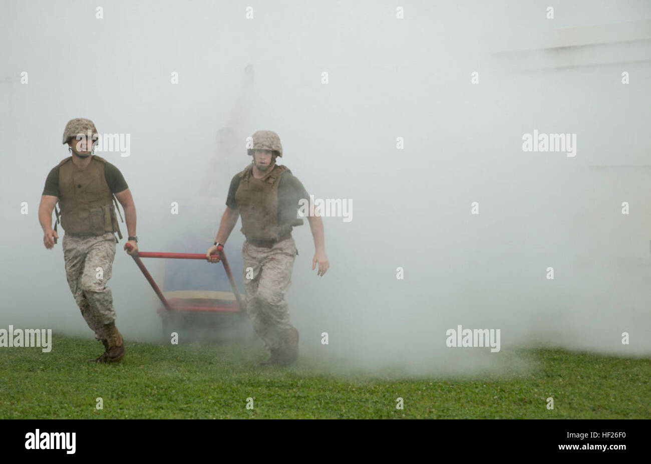 Staff Sgt. Justin E. Frye, center, and Sgt. Cody L. Privette, left ...