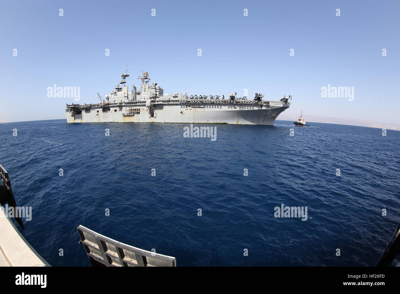 The USS Bataan (LHD-5) prepares to dock at the Royal Jordanian Naval ...