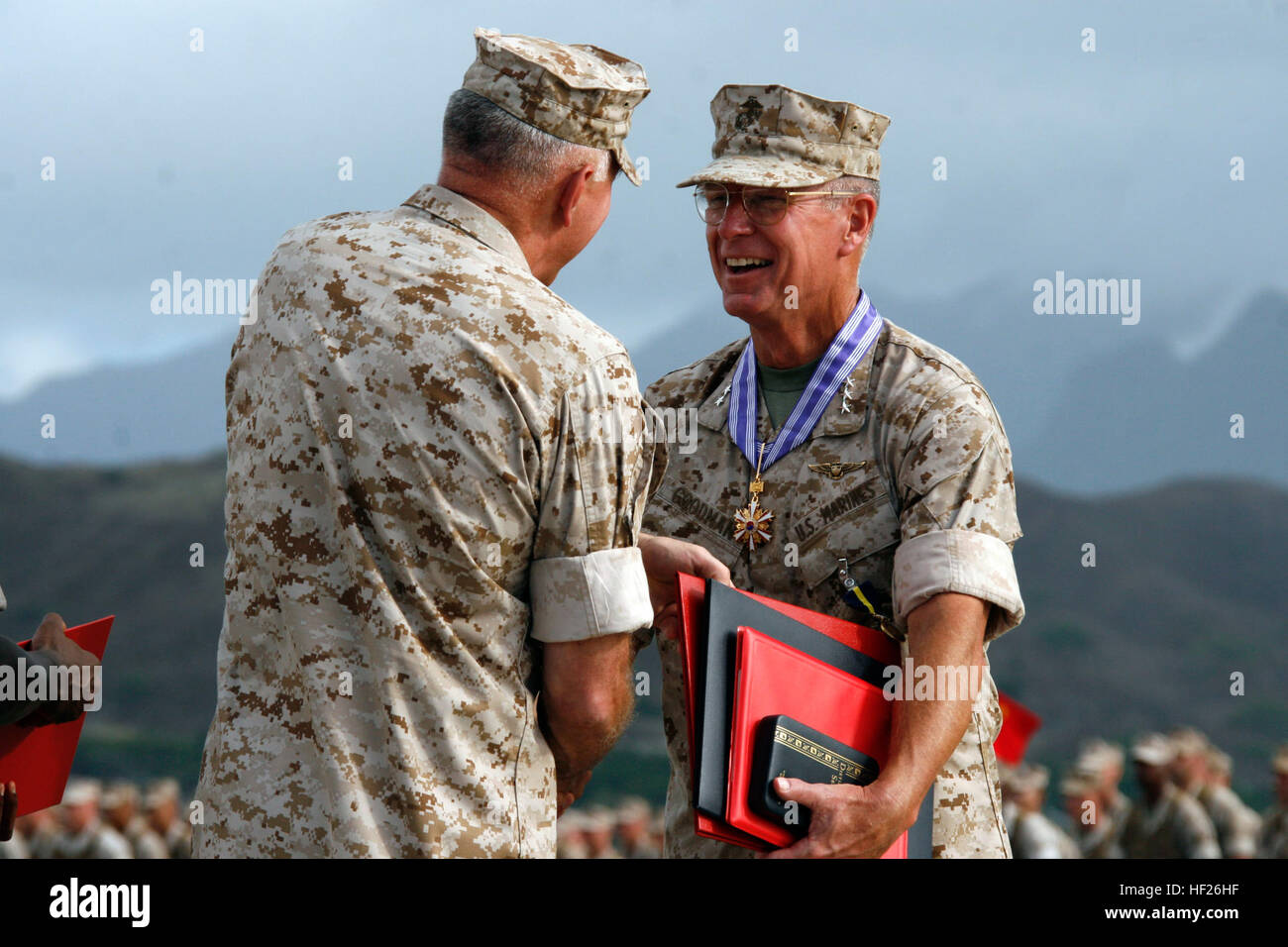 Lt. Gen. John F. Goodman, (right) commander, U.S. Marine Corps Forces, Pacific, shakes hands ...