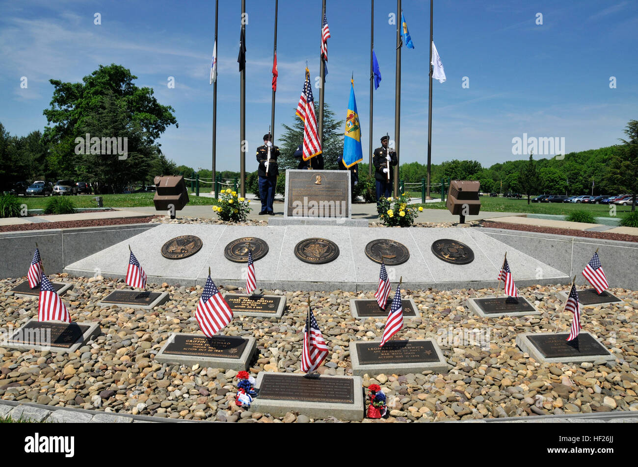 Members of the Delaware National Guard Honor Guard present the colors ...