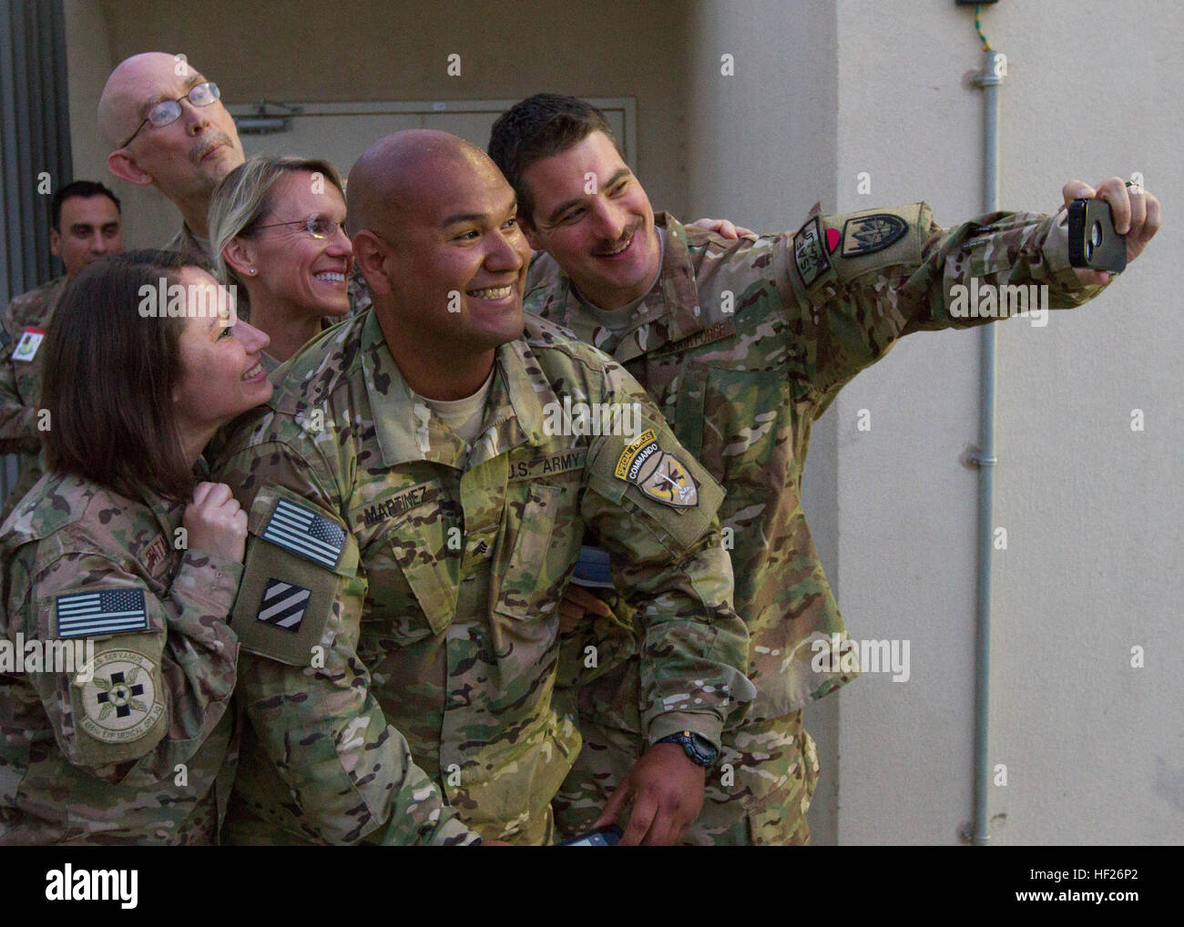 Retired U.S. Army Sgt. Saul Martinez poses for a selfie with the staff ...