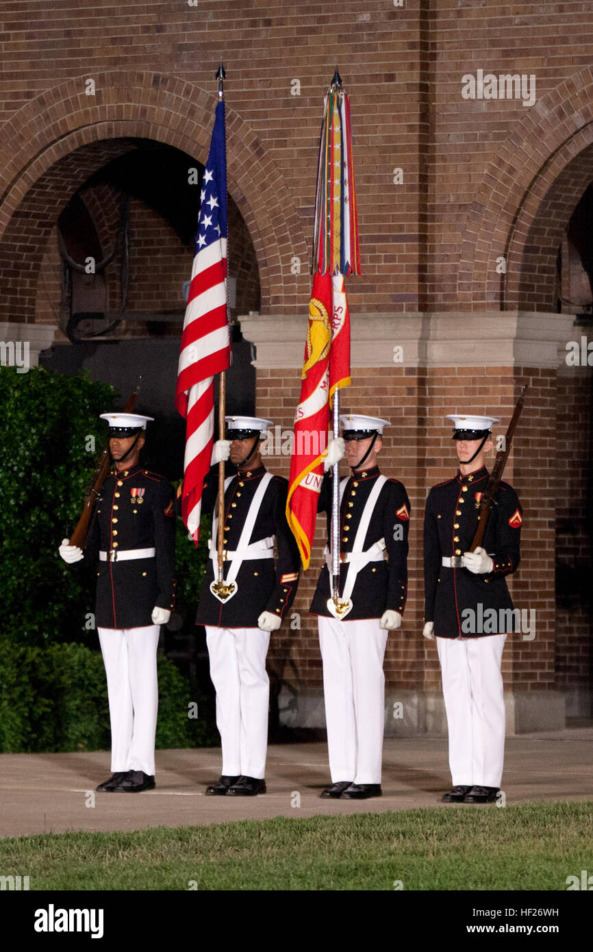 Members of a U.S. Marine color guard display the colors during the ...