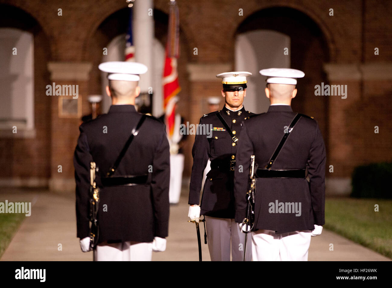 U.S. Marines stand at center walk during the Evening Parade at Marine ...