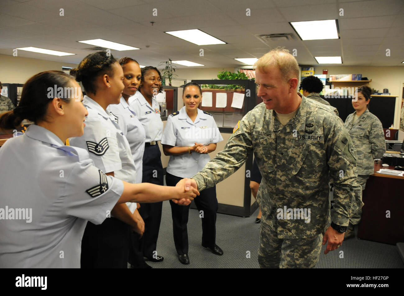 Airmen from the 192nd Fighter Wing fill out paperwork before receiving their vaccines for ...
