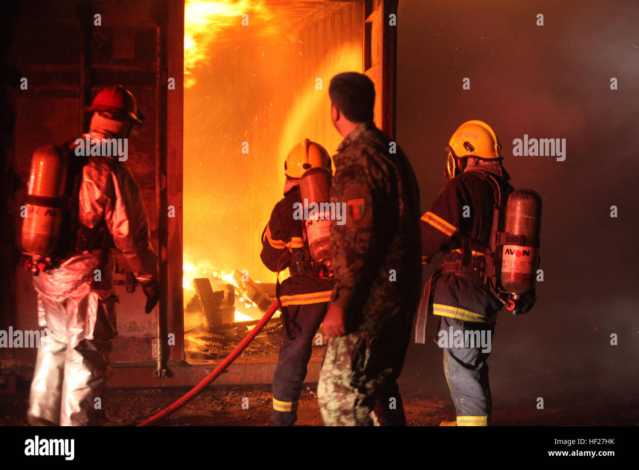 Afghan National Army soldiers with the 215th Corps work to extinguish a ...