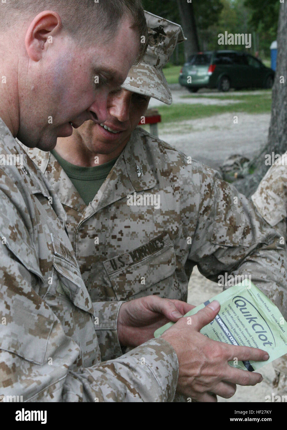 Lt. Col. Scott Stebbins (left), communications operations officer with ...