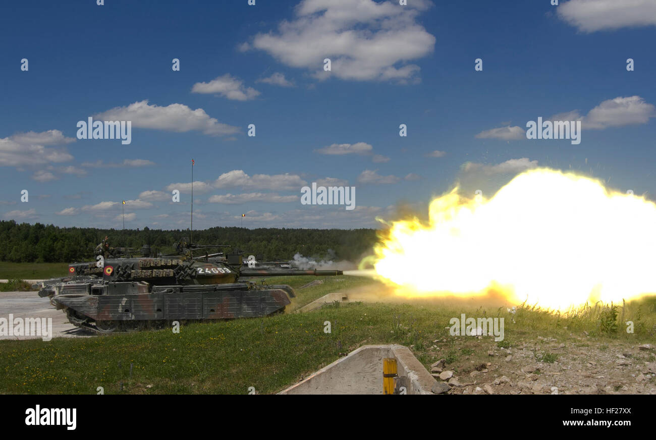 Romanian Army personnel operate a T‑85M1 tank during live‑fire gunnery ...