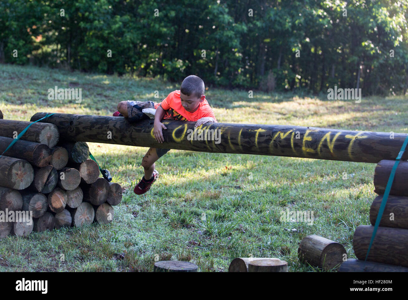 A young boy concurs a log obstacle during the annual Marine Corps ...