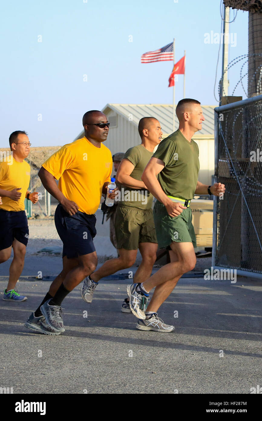 U.S. Navy sailors and Marines participate in a motivational run aboard ...