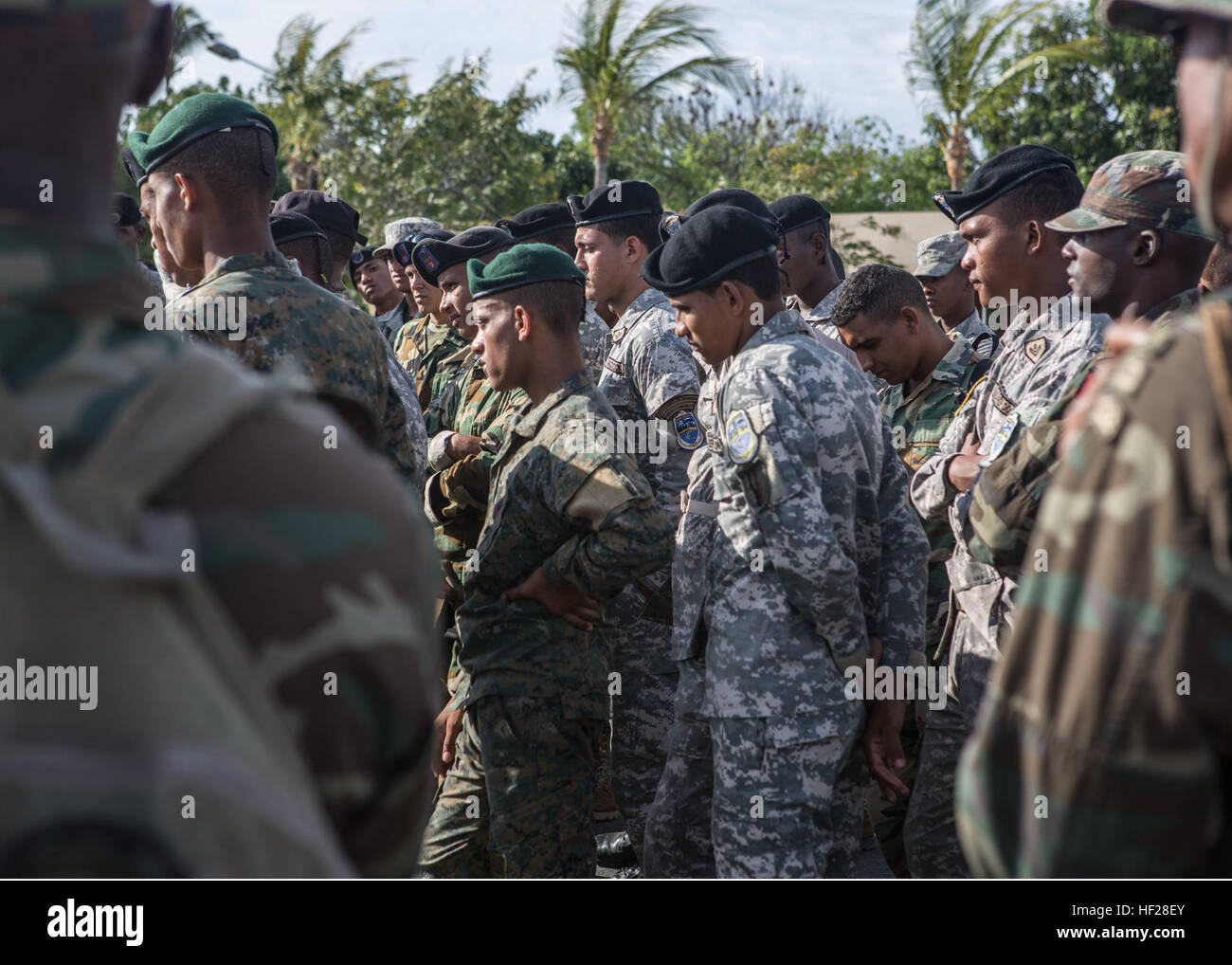 Military members from 13 partner nations listen to instructions during ...