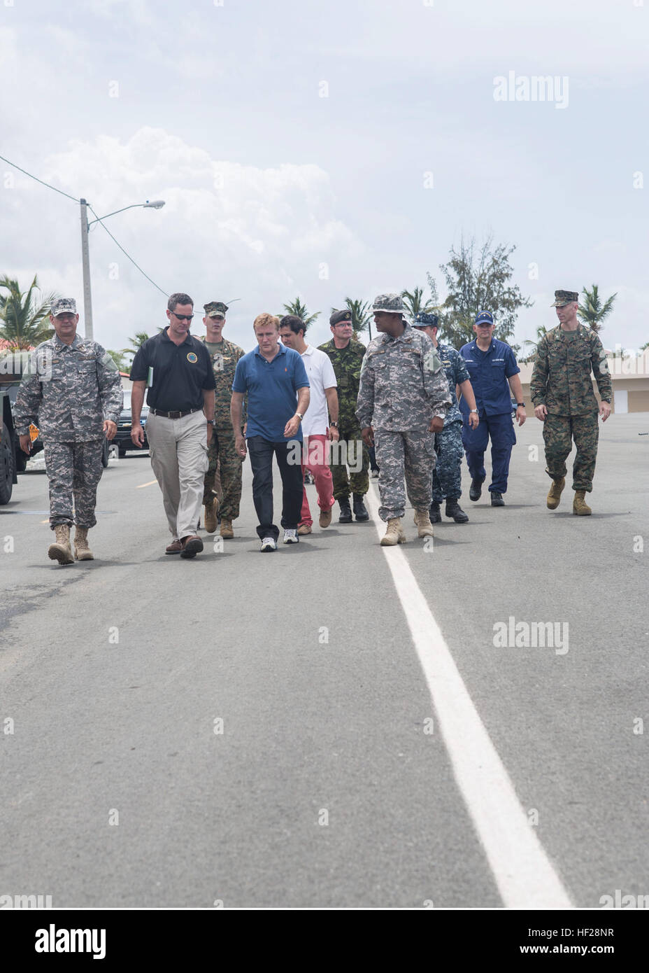James Brewster, U.S. Ambassador for the Dominican Republic, walks with ...