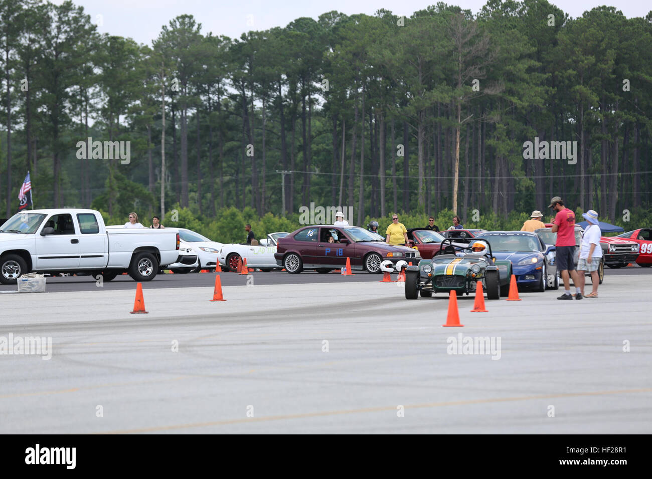 Marines and members of Sports Car Club of America wait to be motioned ...