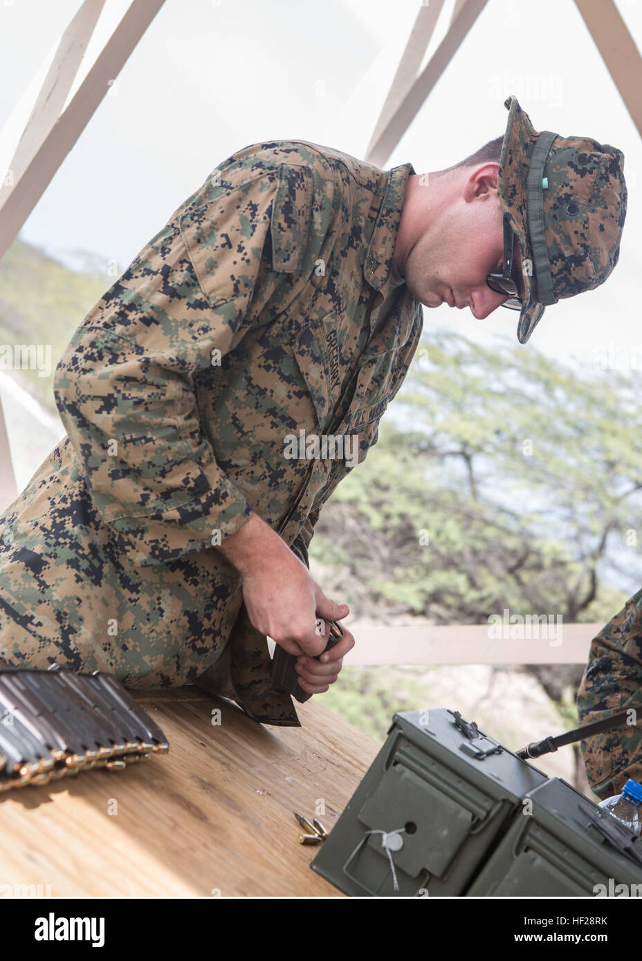 U.S. Marine Lance Cpl. James Gregory, MP COC, C Company, loads ...