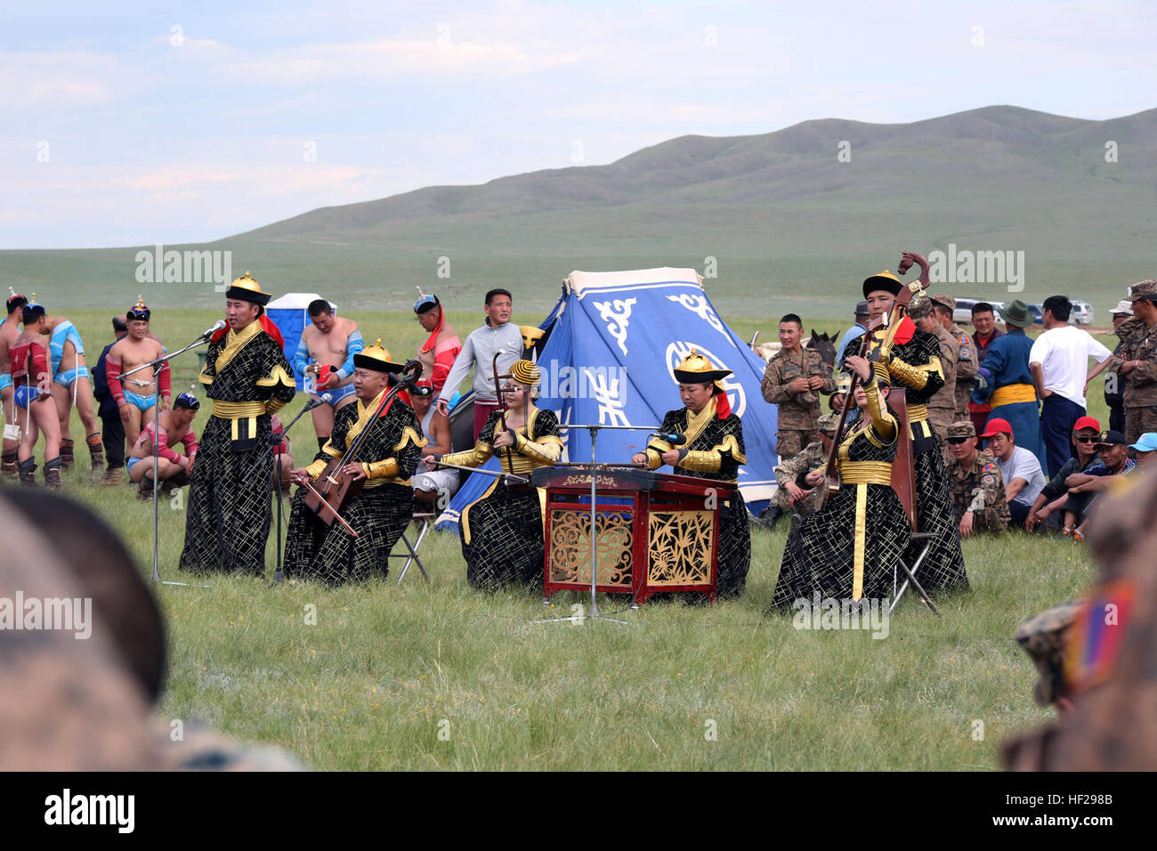 Mongolians perform throat singing during a mini-Naadam festival June 27 ...