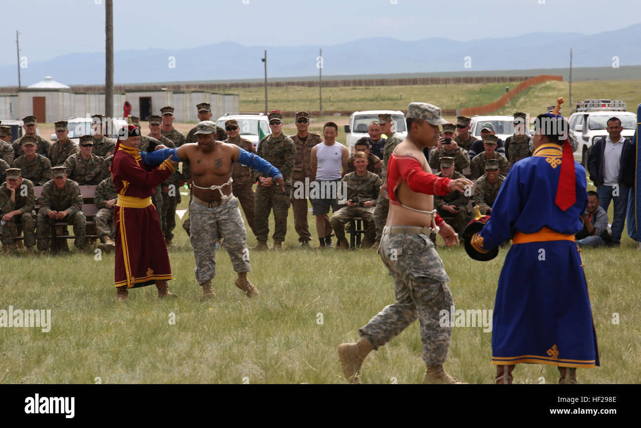 U.S. soldiers wearing traditional Mongolian wrestling attire perform ...