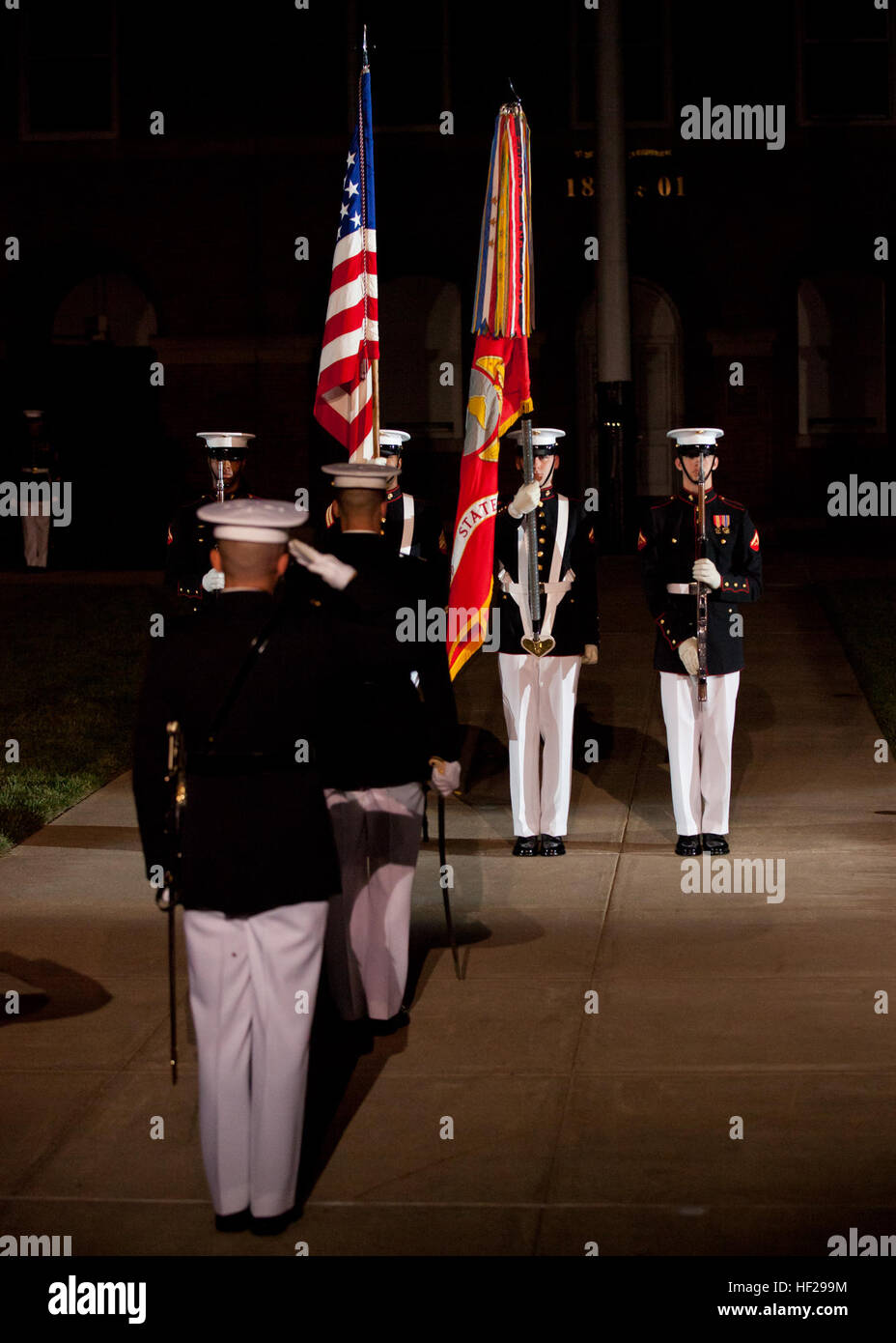 Members of a U.S. Marine color guard present the colors during an ...