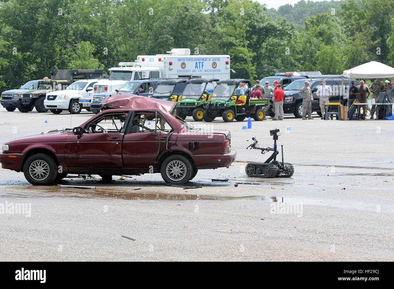 202nd EOD Company personnel use a robot to inspect a vehicle during a ...