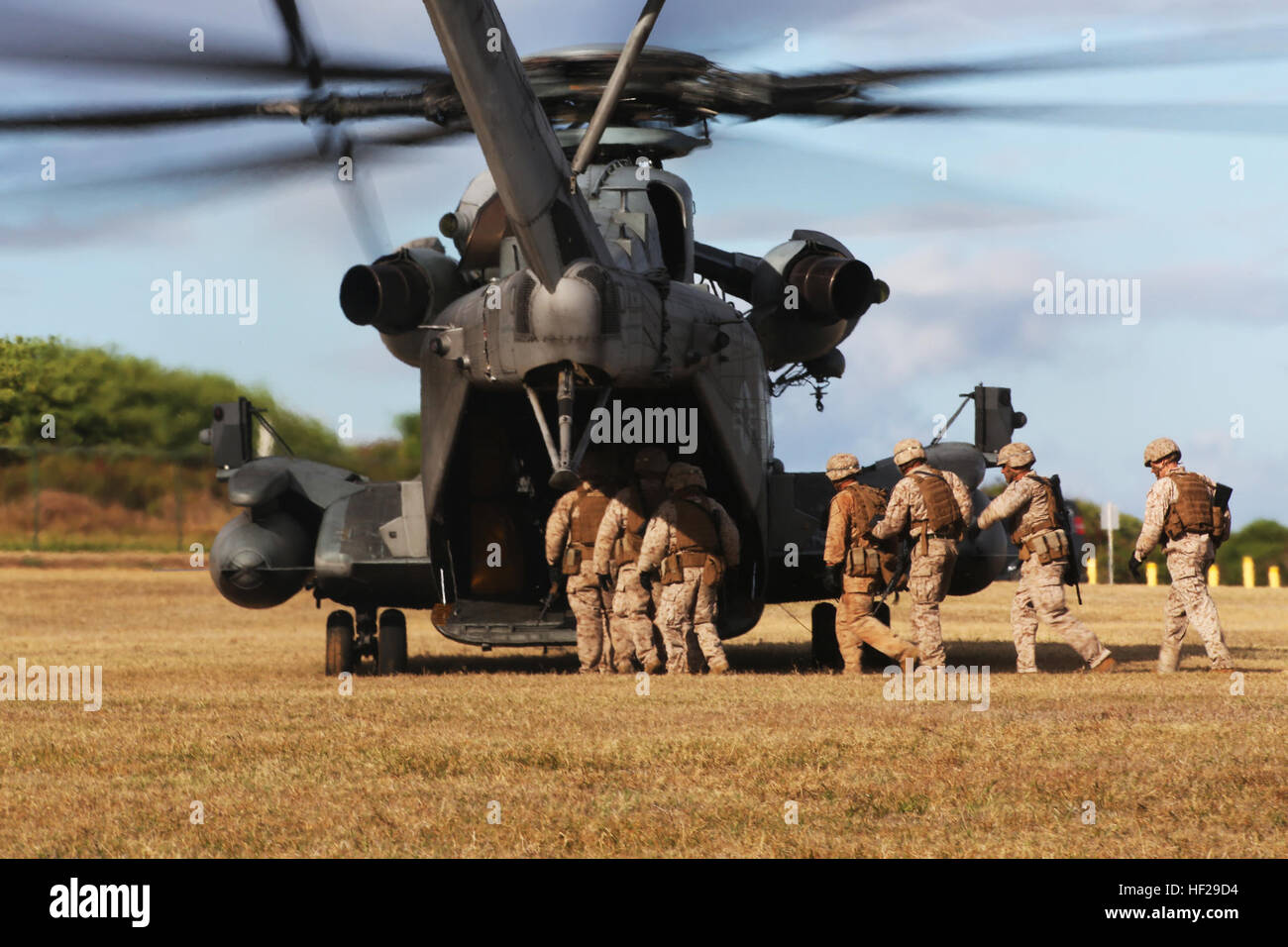 U.S. Marines with 3rd Battalion, 3rd Marine Regiment, board a CH-53E ...