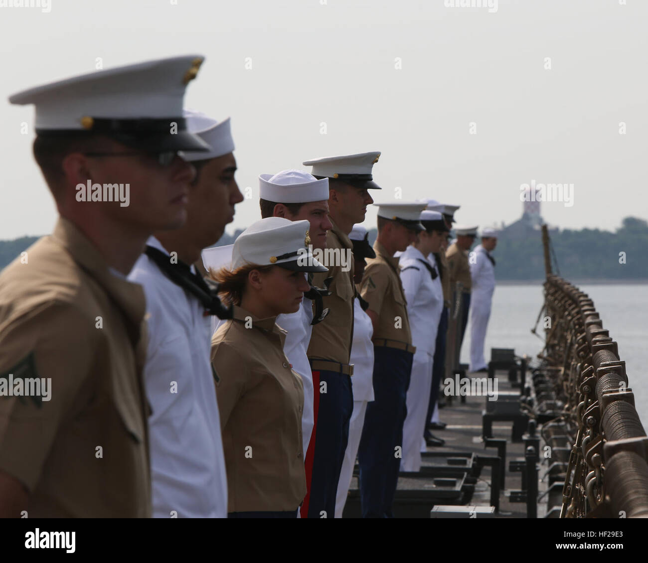 Marines and sailors aboard the USS Oak Hill man the rails as the ship ...