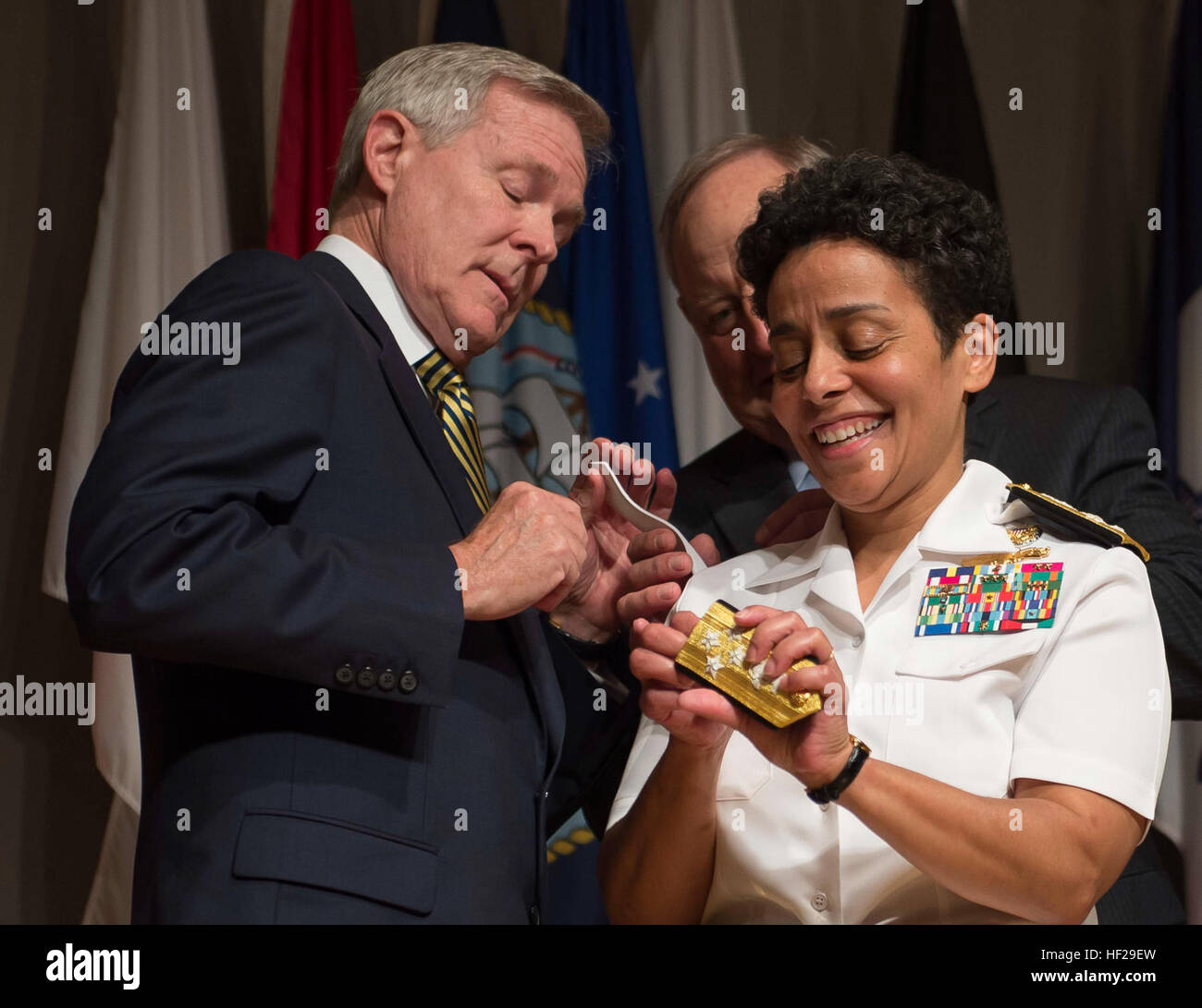 Adm. Michelle Howard lends a hand to Secretary of the Navy (SECNAV) Ray ...