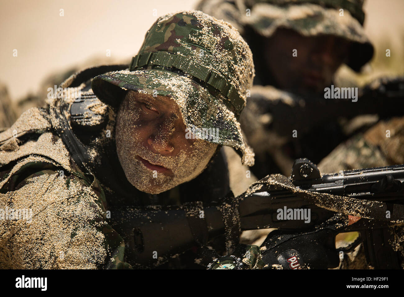A soldier with the Japan Ground Self-Defense Force (JGSDF) waits for ...