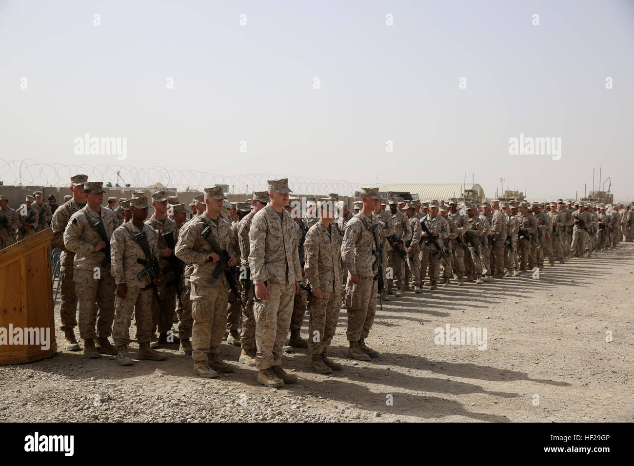 Marines with 1st Battalion, 7th Marine Regiment, line up to pay their ...