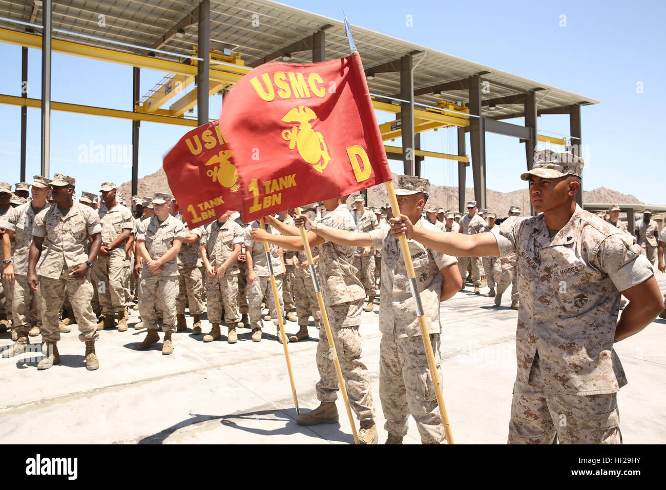 Guidon bearers with 1st Tank Battalion stand at parade rest as Major ...