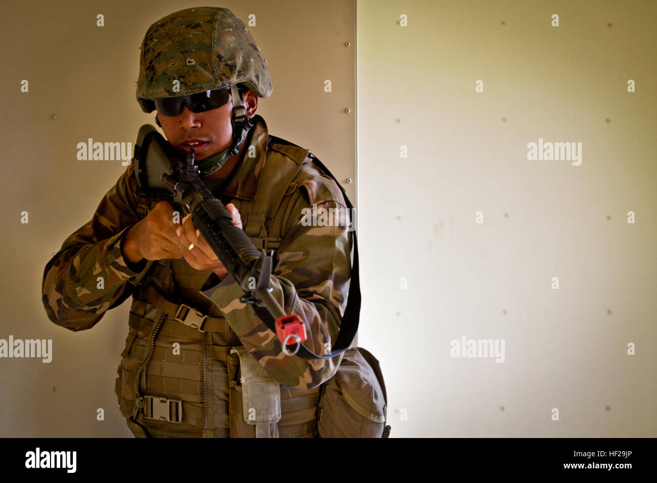 A Royal Tongan Marine secures a room while others clear the rest of the ...