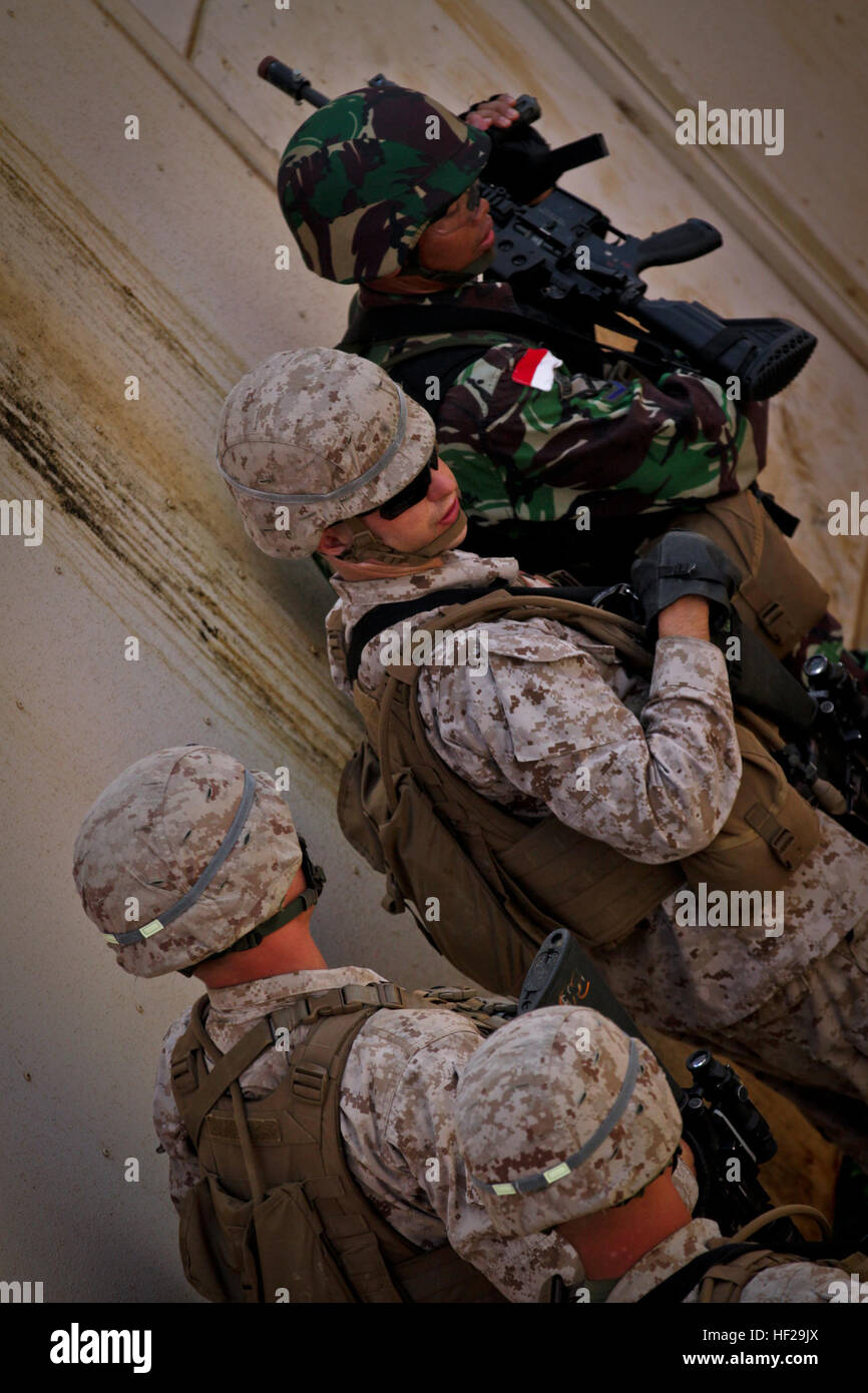 U.S. Marines and an Indonesian Marine stack together in preparation for ...