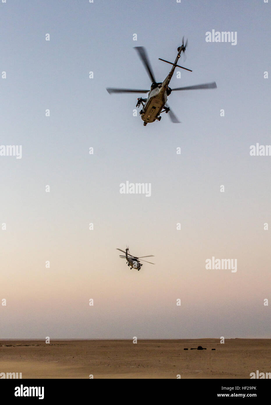 Two Navy MH-60S Sea Hawk helicopters from the aircraft carrier USS ...
