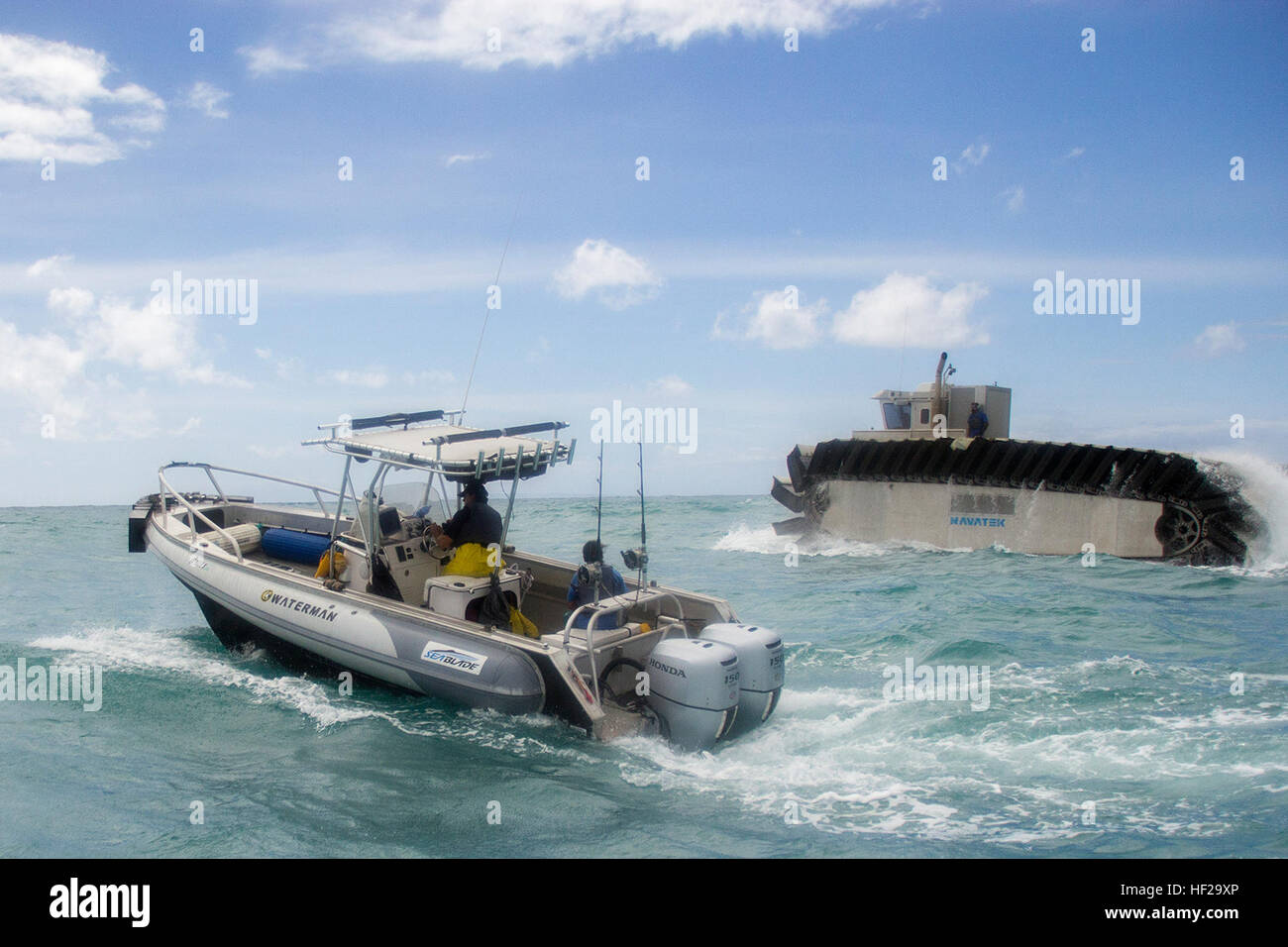 MARINE CORPS TRAINING AREA BELLOWS, Hawaii - A chase boat follows the ...