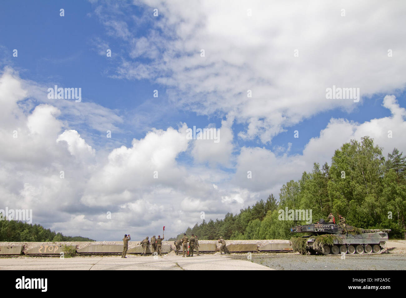 German Army Soldiers from the 104th Panzer Battalion fire small arms ...