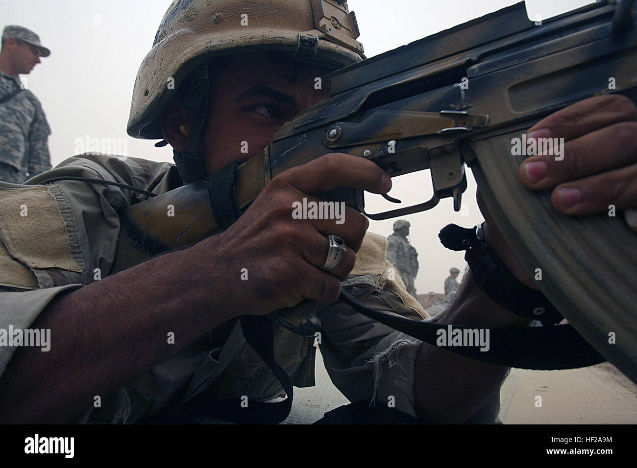 An Iraqi Army noncommissioned officer sends hot metal downrange during ...