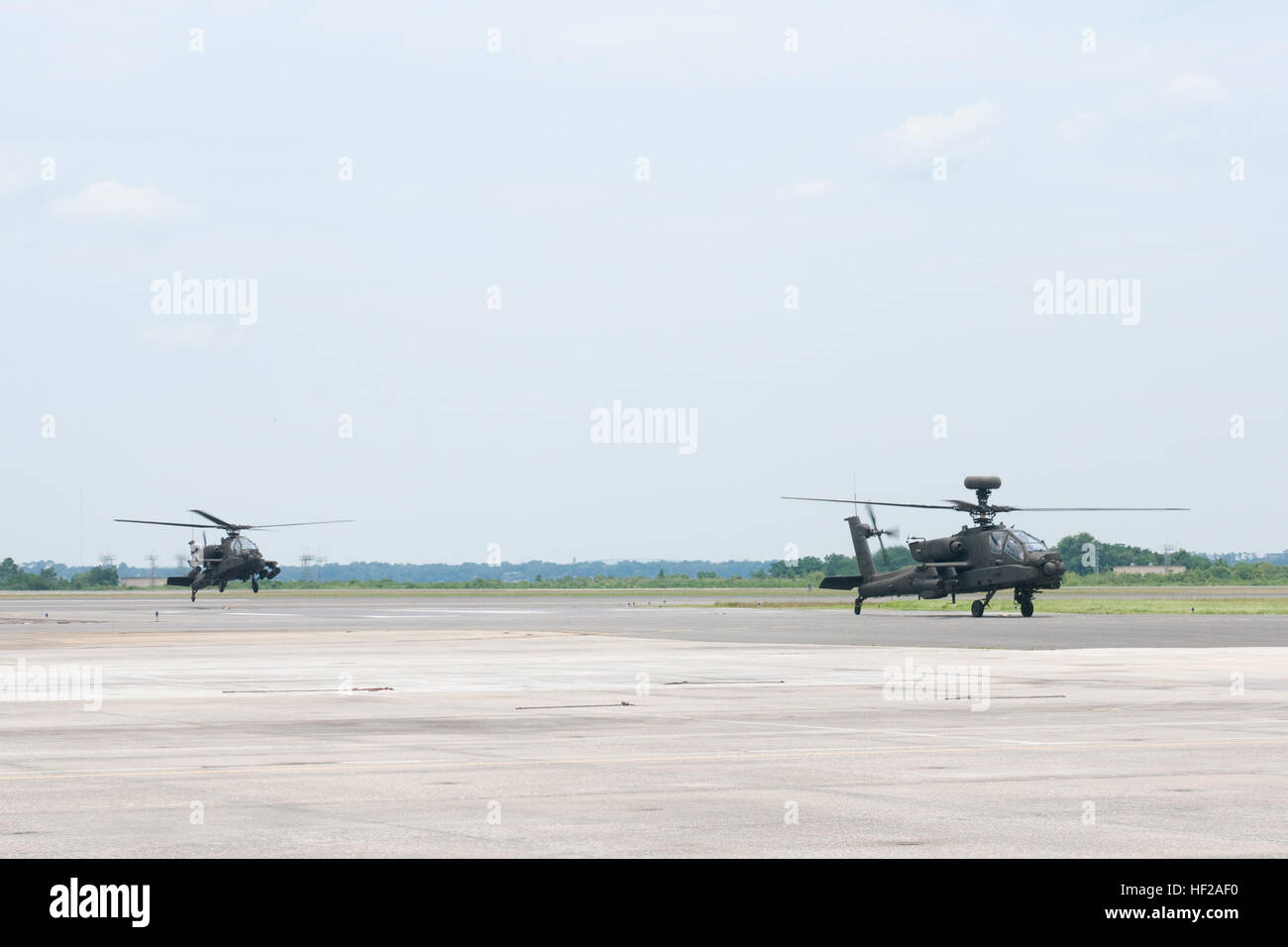 Two AH-64 Apache attack helicopters from the 1-151st Attack ...