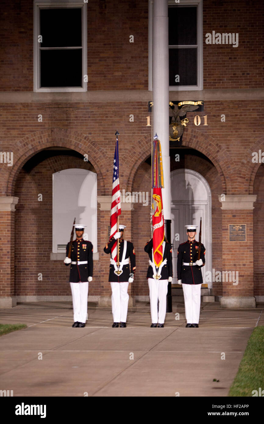 Members of a U.S. Marine Corps color guard present the colors during an ...