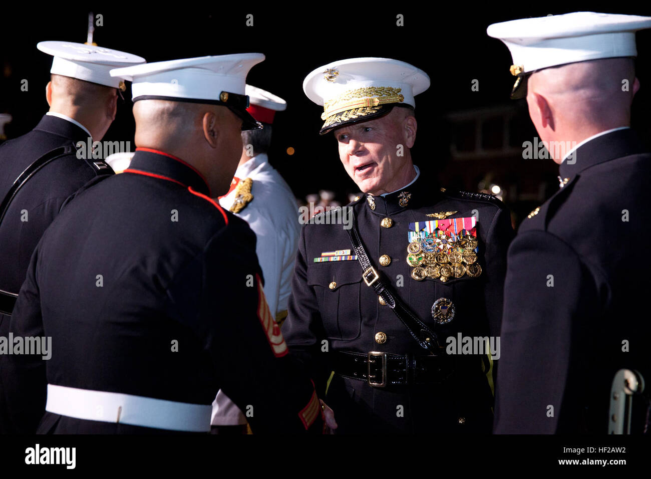 The Commandant of the Marine Corps, Gen. James F. Amos, center, greets ...