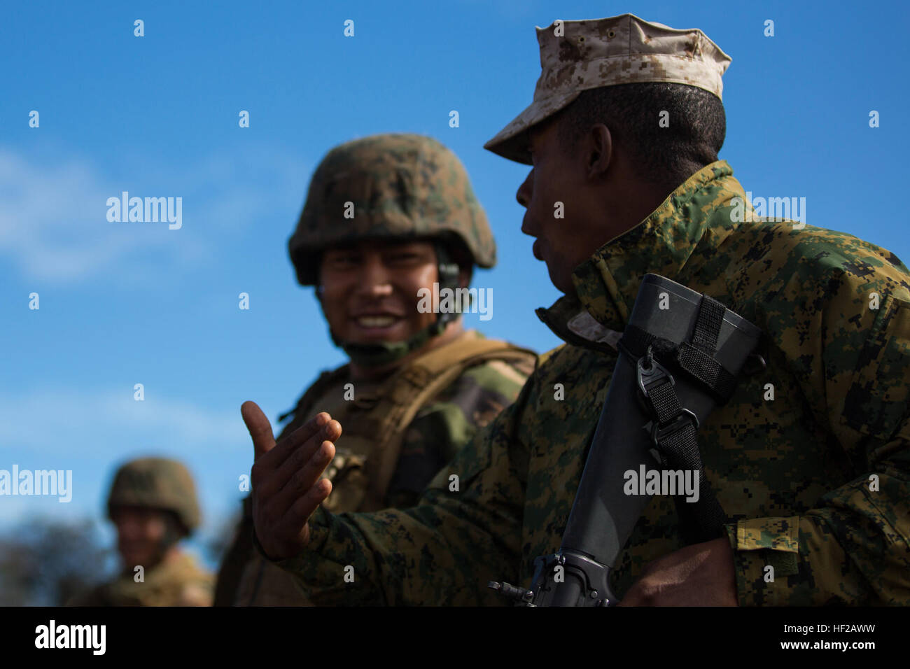 A U.S Marine, with Combined Landing Team 3, instructs a Royal Tongan ...
